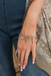 Golden Gaze Eyelet Charm Bracelet: Luxurious Handcrafted Gold Wristwear
